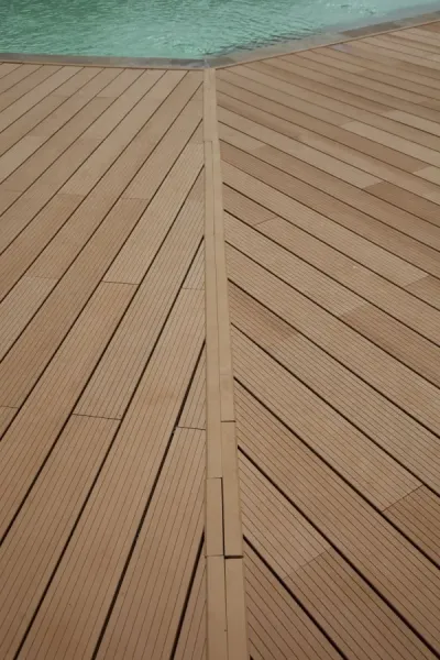 Cushion of Decking platform around swimming pool made