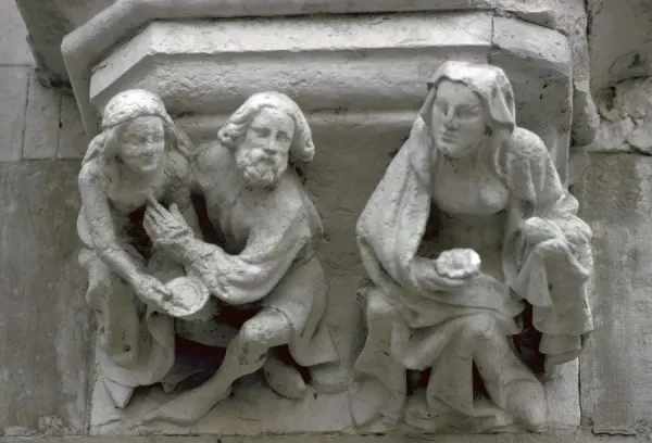 Glass Coaster of Stone carving on the side of a house in Bruges