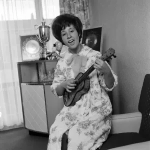 Cushion of 14 year old singer Helen Shapiro, trying on clothes